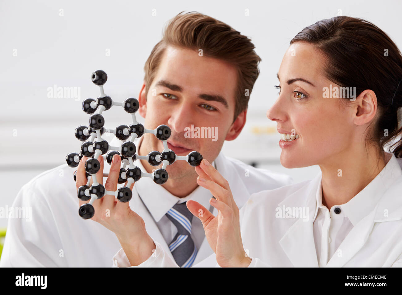 Female scientist studying molecular model hi-res stock photography and ...