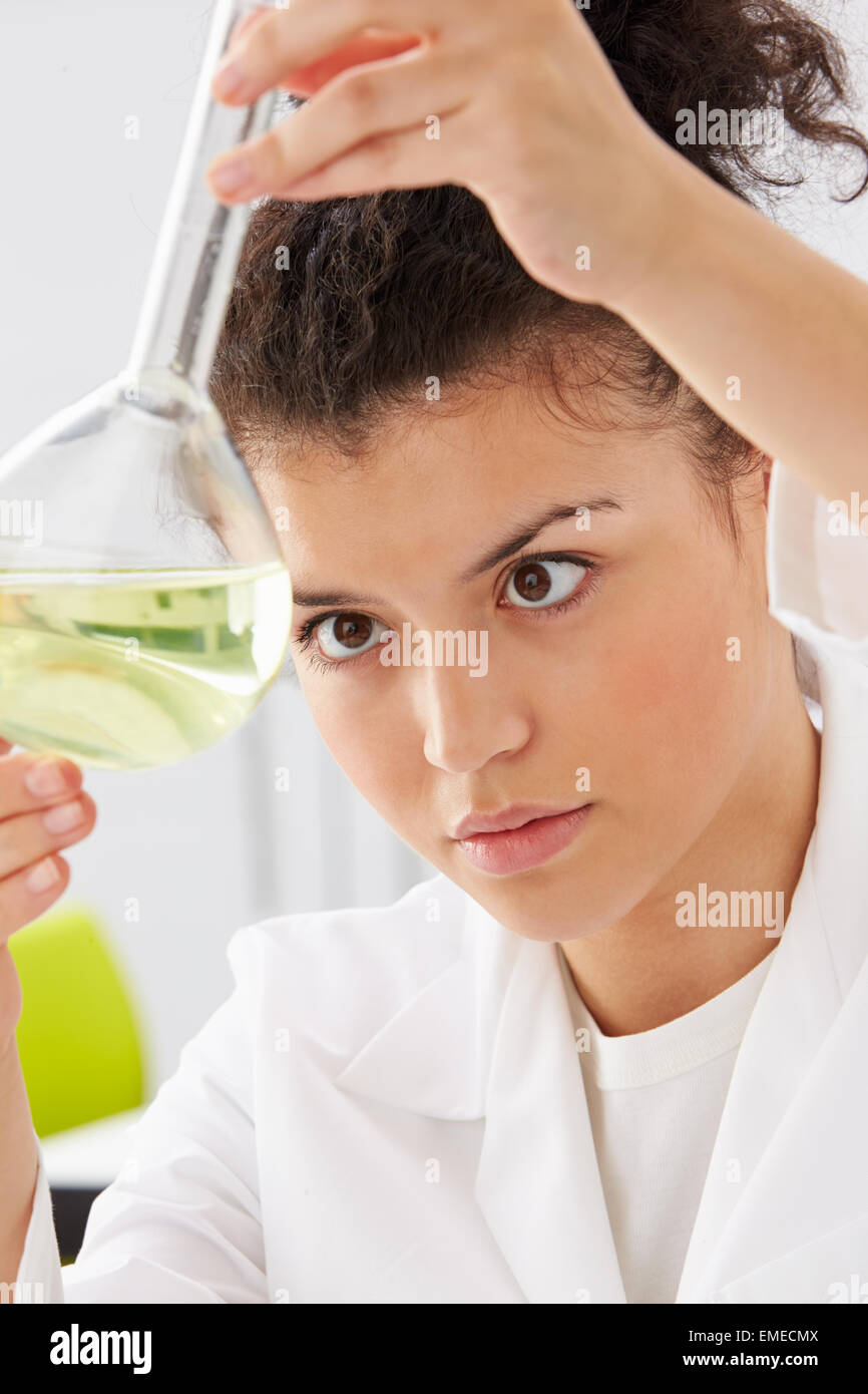 Female Scientist Studying Liquid In Flask Stock Photo - Alamy