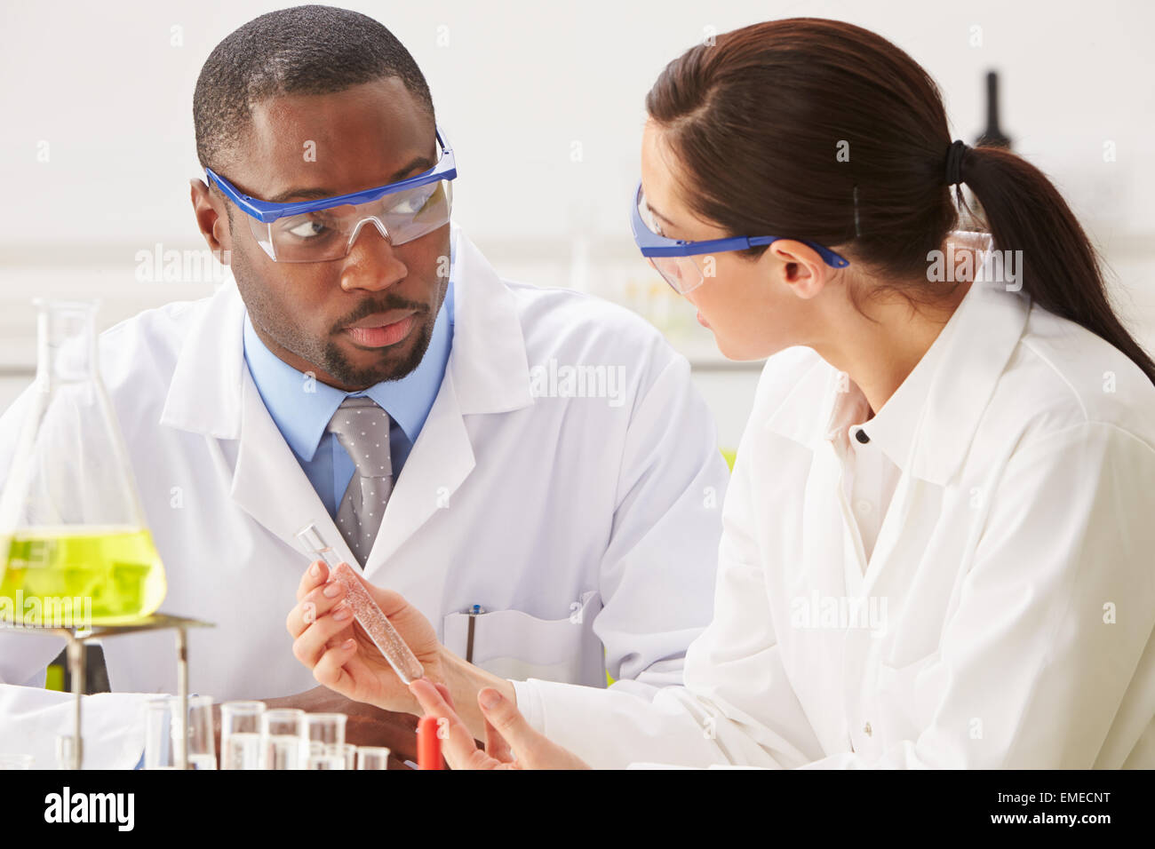 Two Scientists Performing Experiment In Laboratory Stock Photo - Alamy