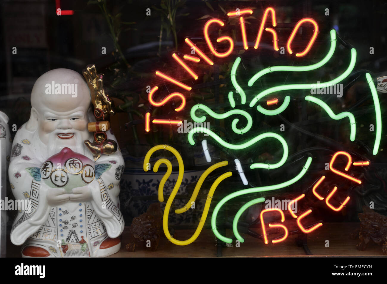 A Tsingtao Beer neon sign in the window of a Chinatown restaurant ...