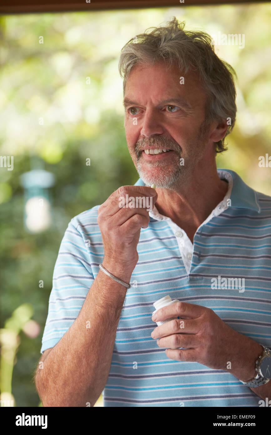 Person taking tablet hi-res stock photography and images - Alamy