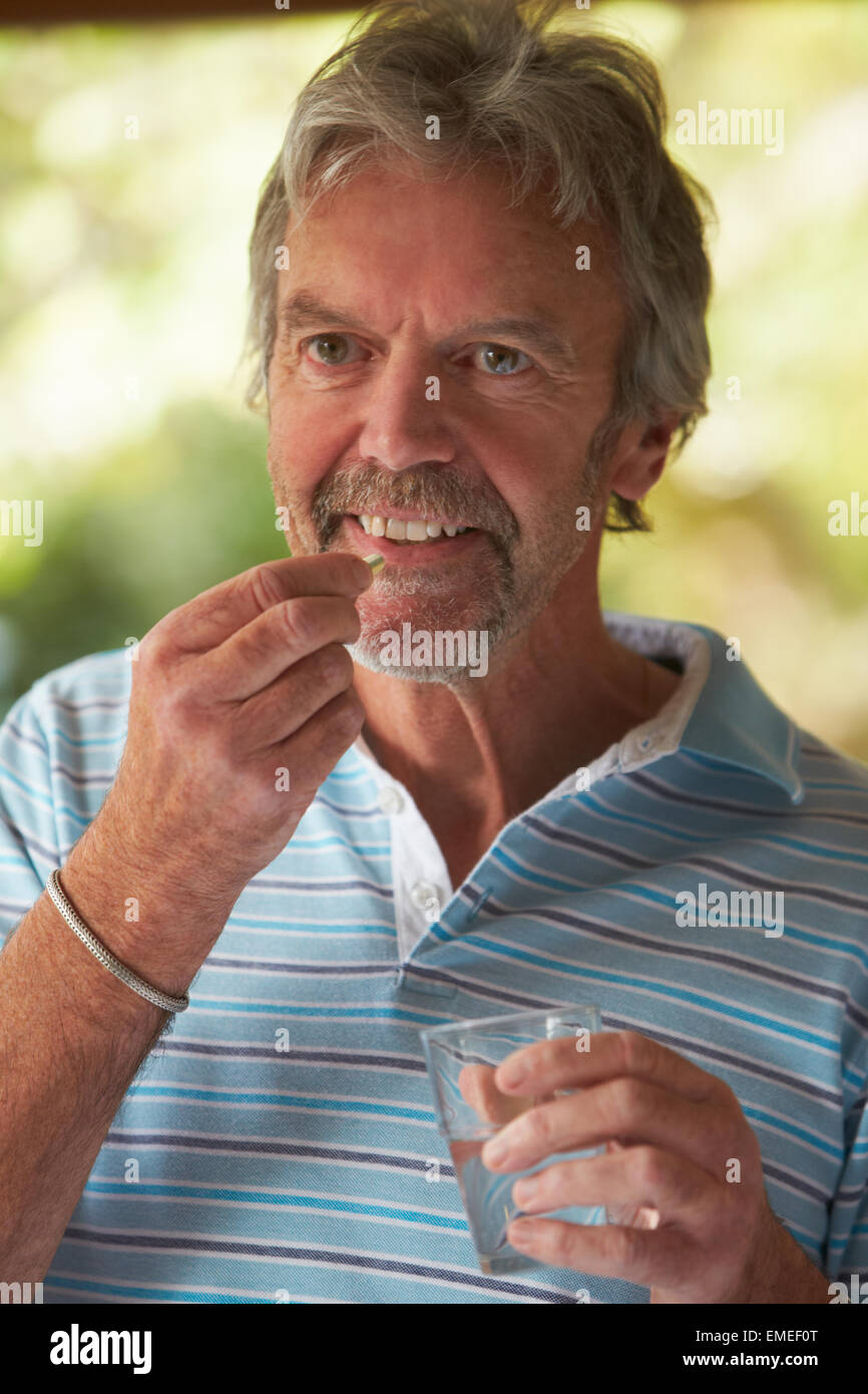 Person taking tablet hi-res stock photography and images - Alamy