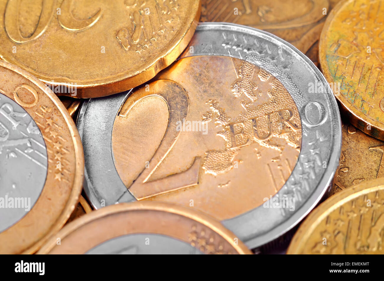Two Euro coin and many coins, close up Stock Photo - Alamy