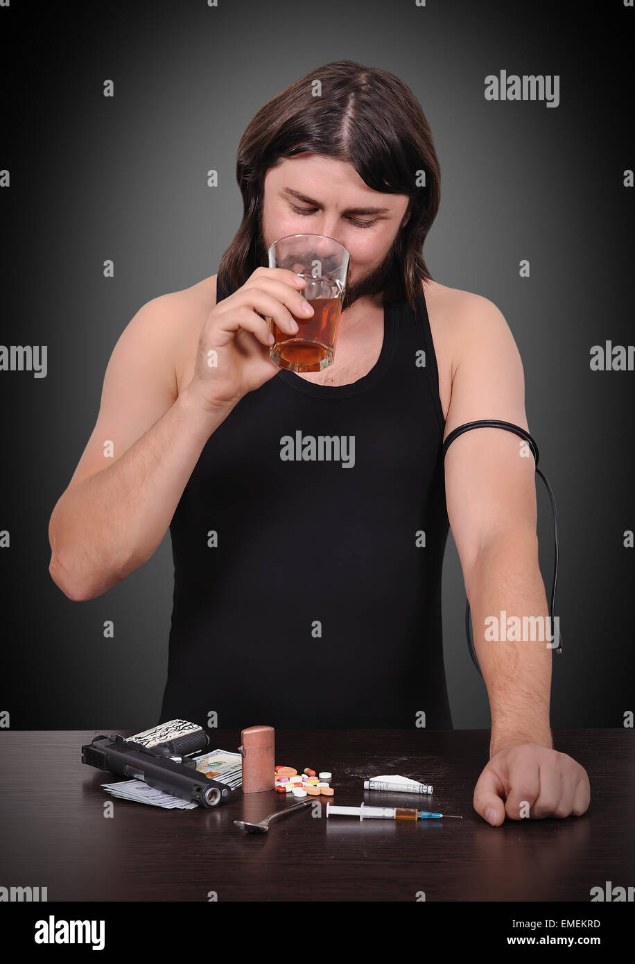 addict man drinking alcohol from a glass Stock Photo - Alamy