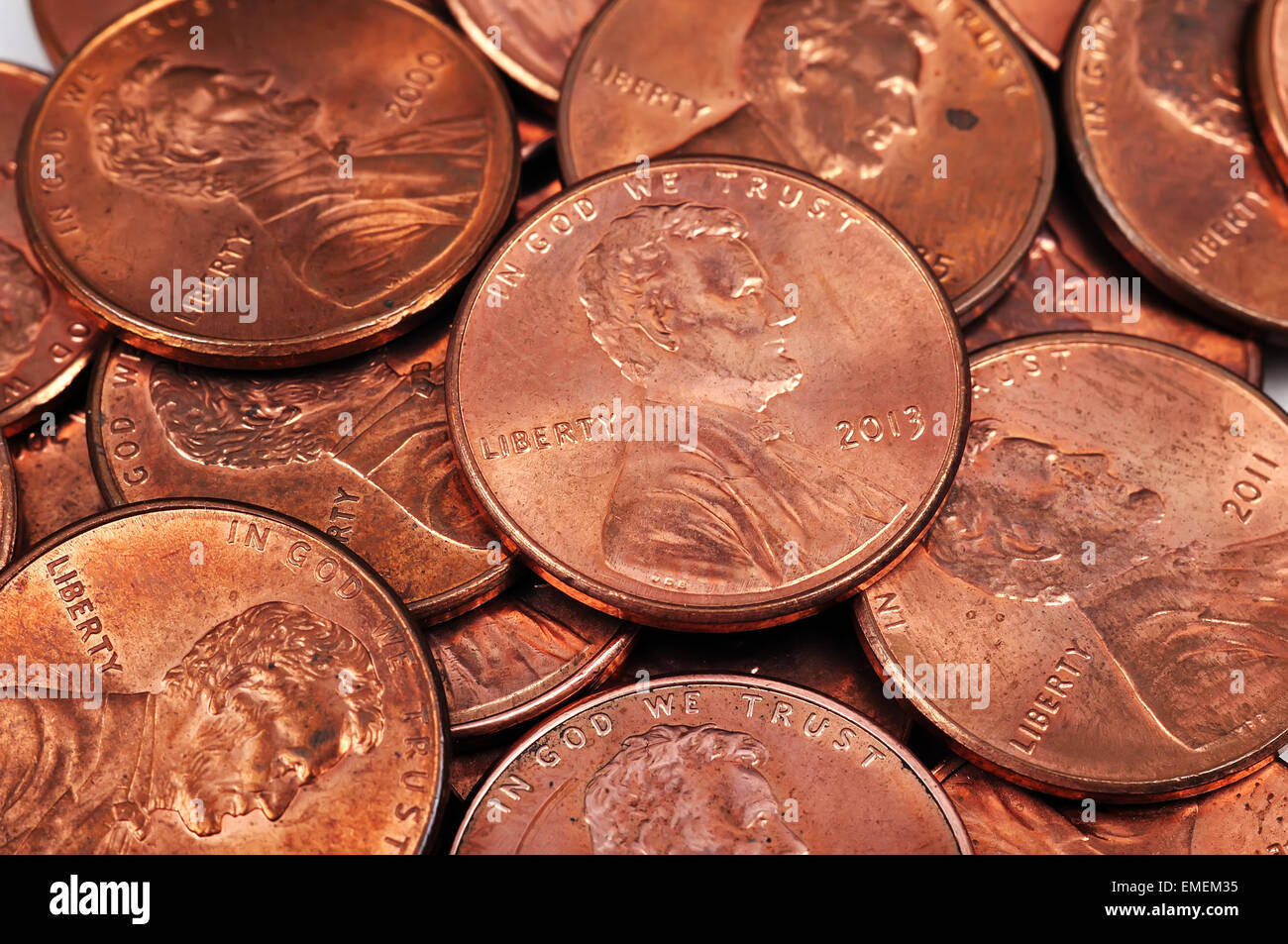 one cent coins isolated on white background Stock Photo - Alamy