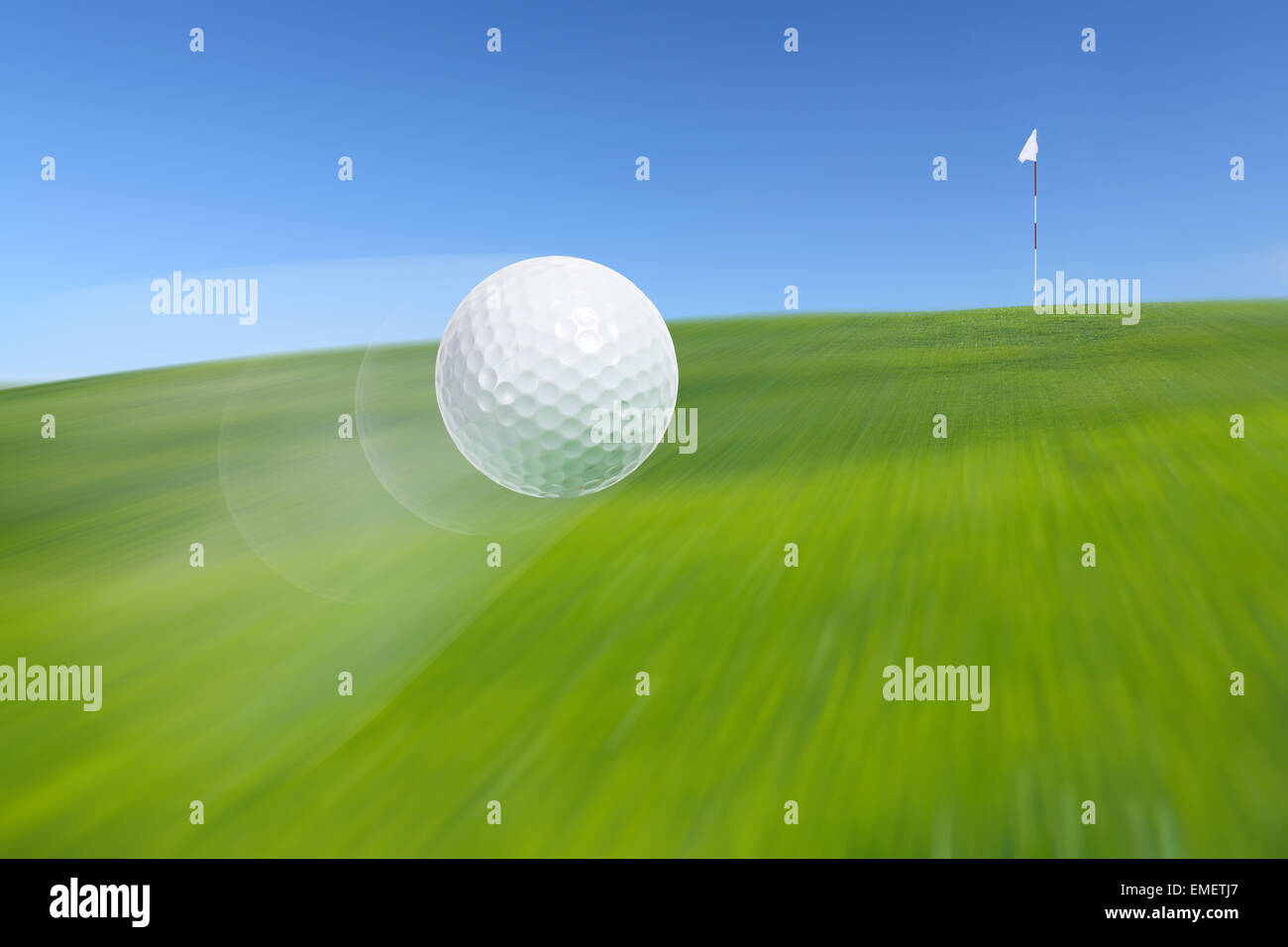 Close-up of flying golf ball over blurred course Stock Photo - Alamy