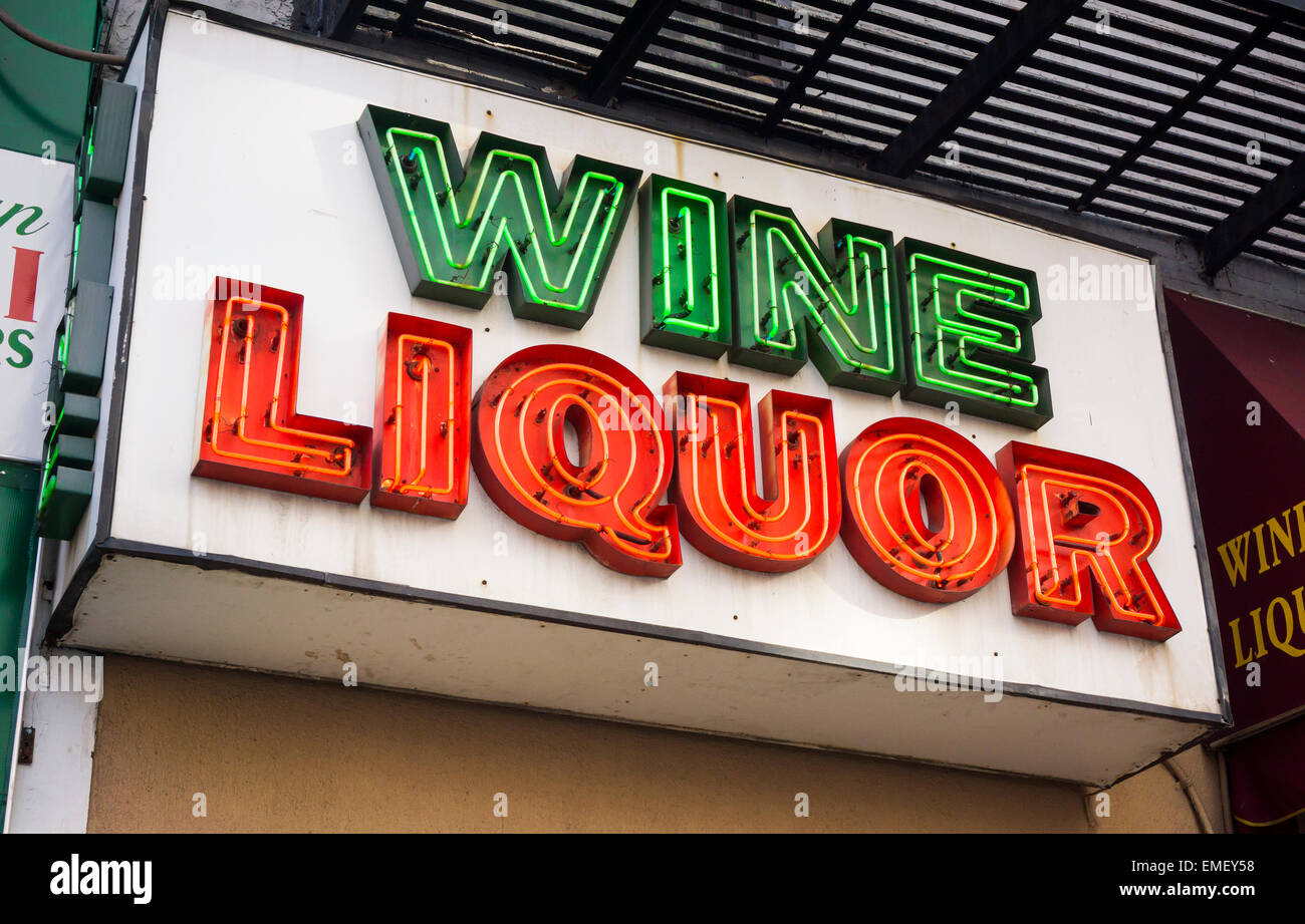 A liquor store displays their "Wine Liquor" neon sign in the Chelsea ...