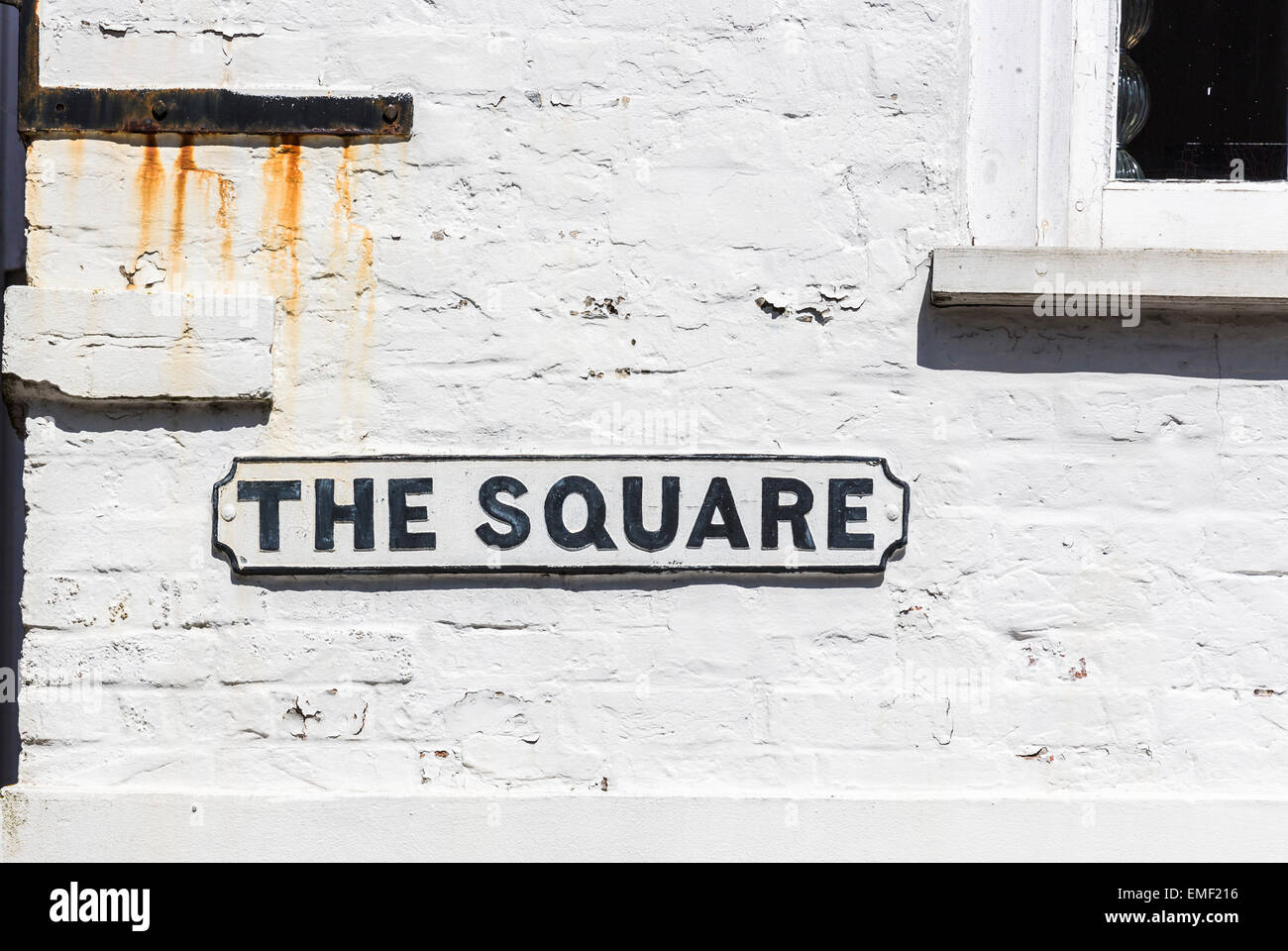 Old fashioned, traditional black and white street sign for The Square ...