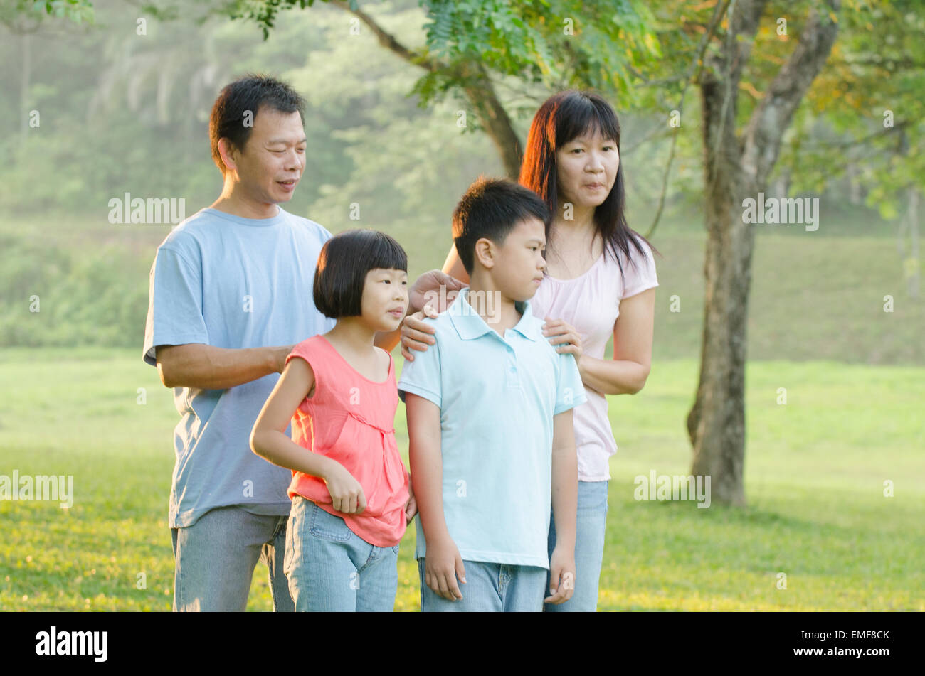 Asian Family Enjoying Walk In Summer Countryside Stock Photo - Alamy