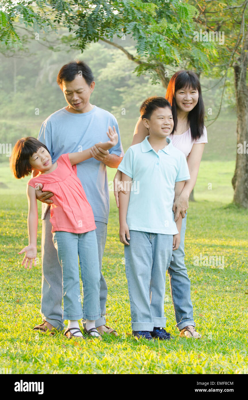 Asian Family Enjoying Walk In Summer Countryside Stock Photo - Alamy