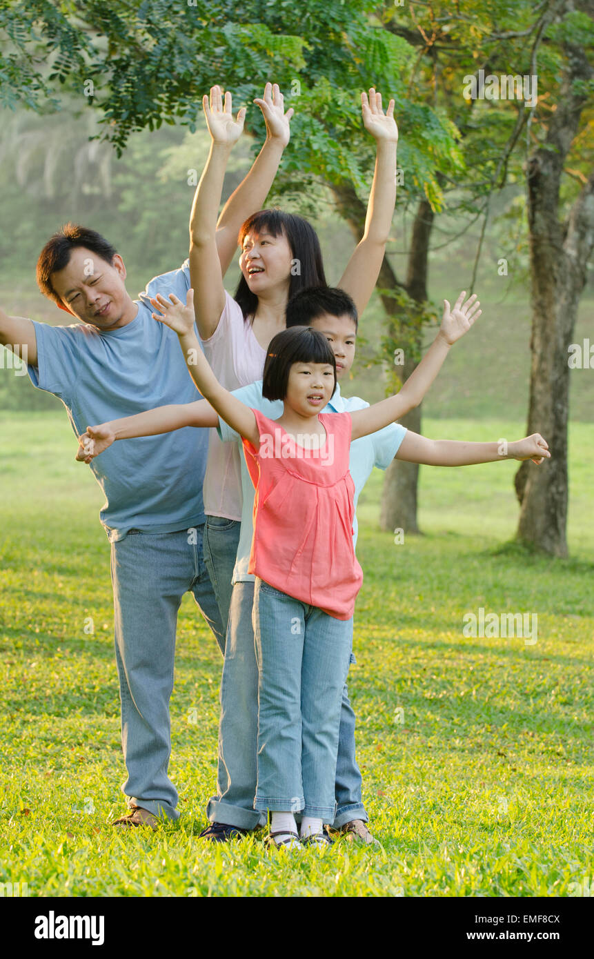 Asian Family Enjoying Walk In Summer Countryside Stock Photo - Alamy