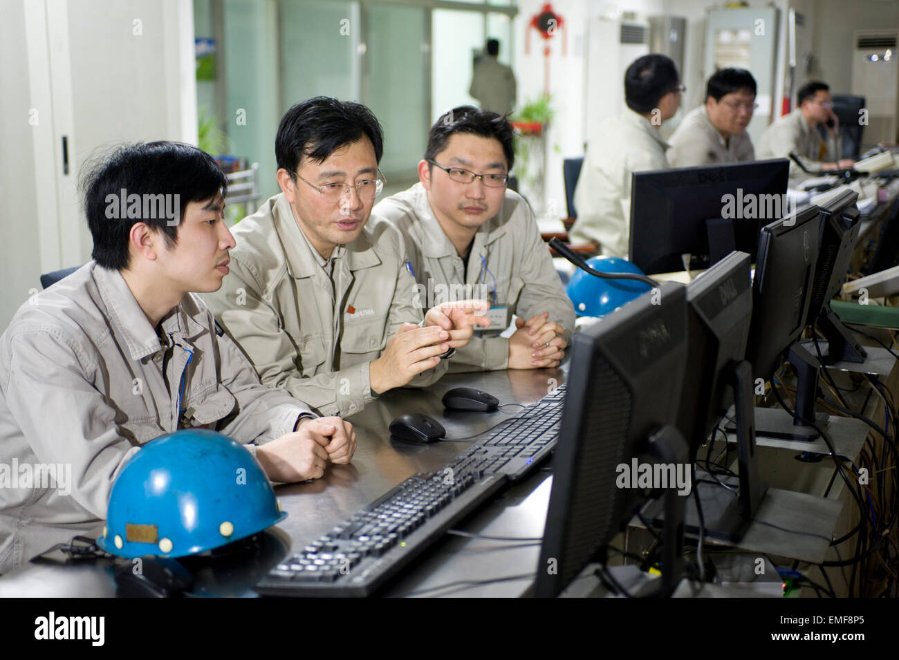 Shanghai, China. 15th Apr, 2015. Engineer Wang Jun (2nd L) of China's ...