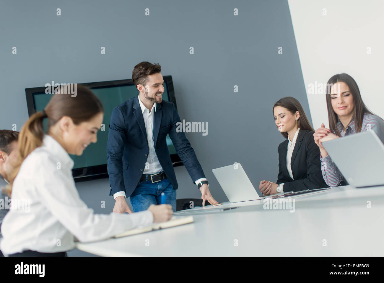 Young people in the office Stock Photo - Alamy
