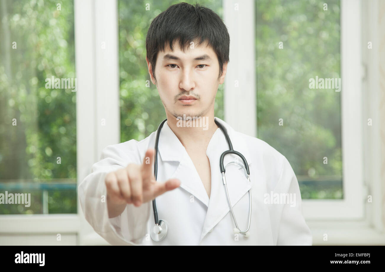 Doctor pointing his finger hi-res stock photography and images - Alamy