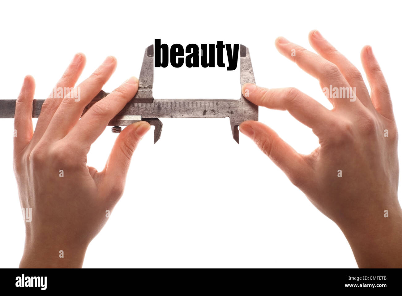 Color horizontal shot of two hands holding a caliper and measuring the ...