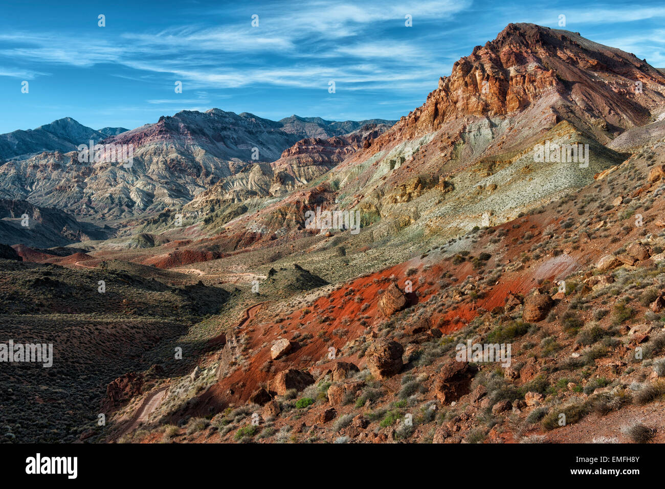A high clearance dirt road travels through the spectacular Titus Canyon ...