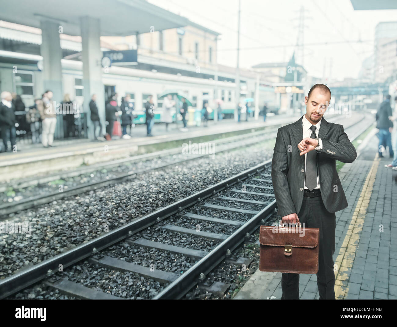 Man standing train station hi-res stock photography and images - Alamy