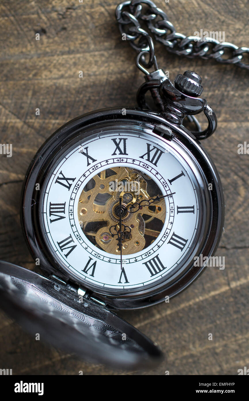 Close up of old pocket watch on rustic wooden background Stock Photo ...