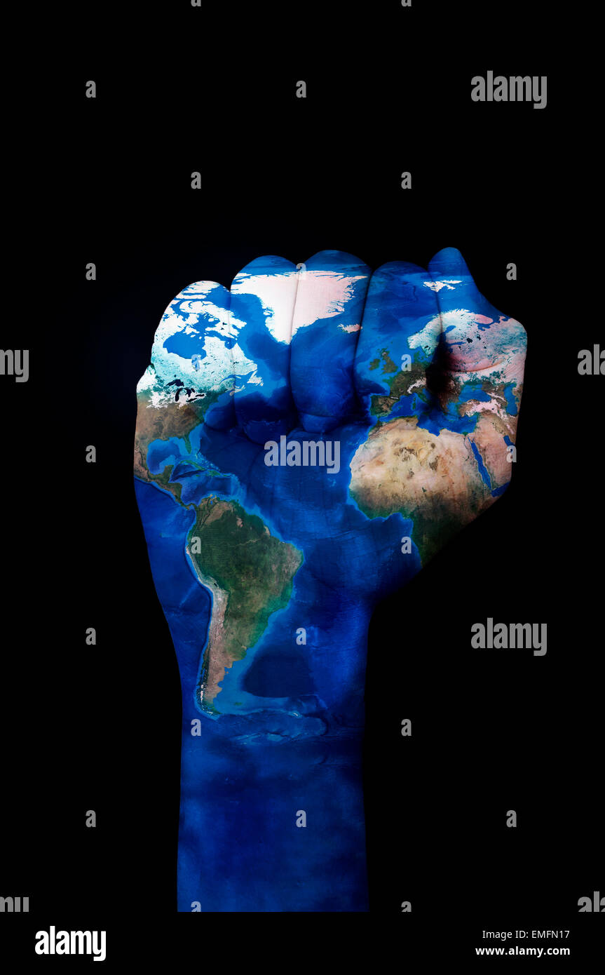 the raised fist of a young man patterned with a world map (furnished by ...