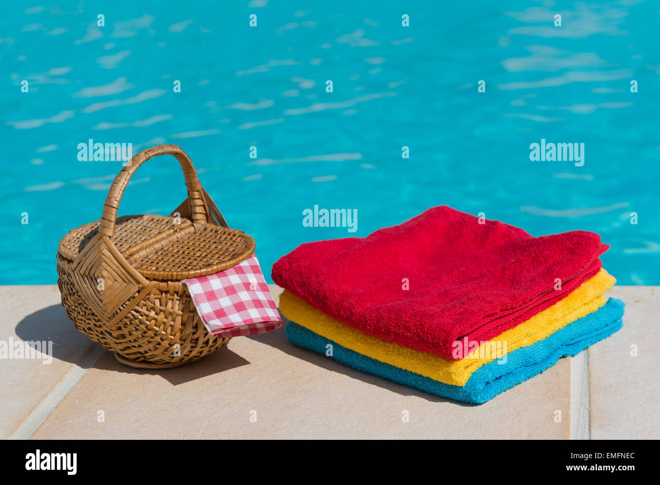 Towels and picnic at te swimming pool Stock Photo - Alamy