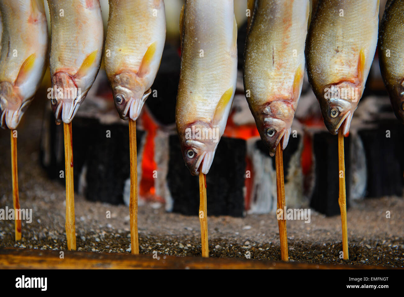 Raw fish with bamboo sticks Stock Photo - Alamy