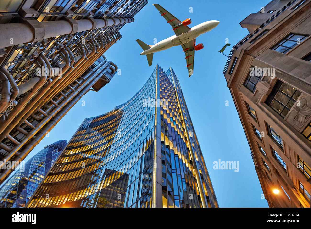 A jet plane flying low over Three different kind of architecture with ...