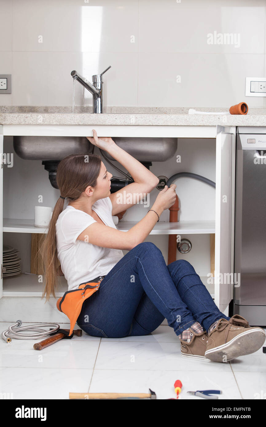 Two plumbers working Stock Photo - Alamy