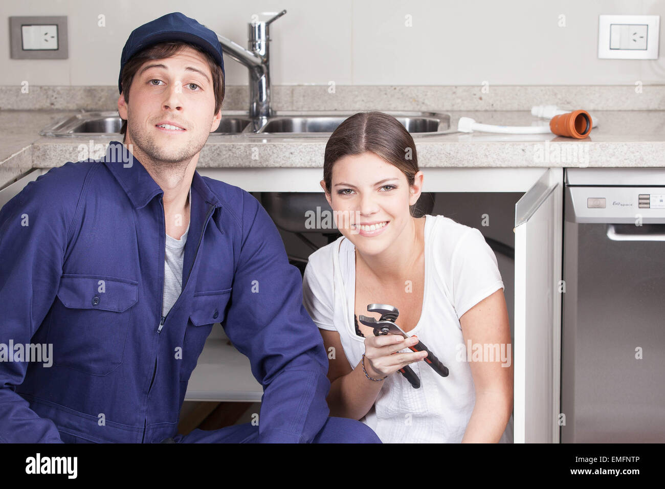 Two plumbers working Stock Photo - Alamy