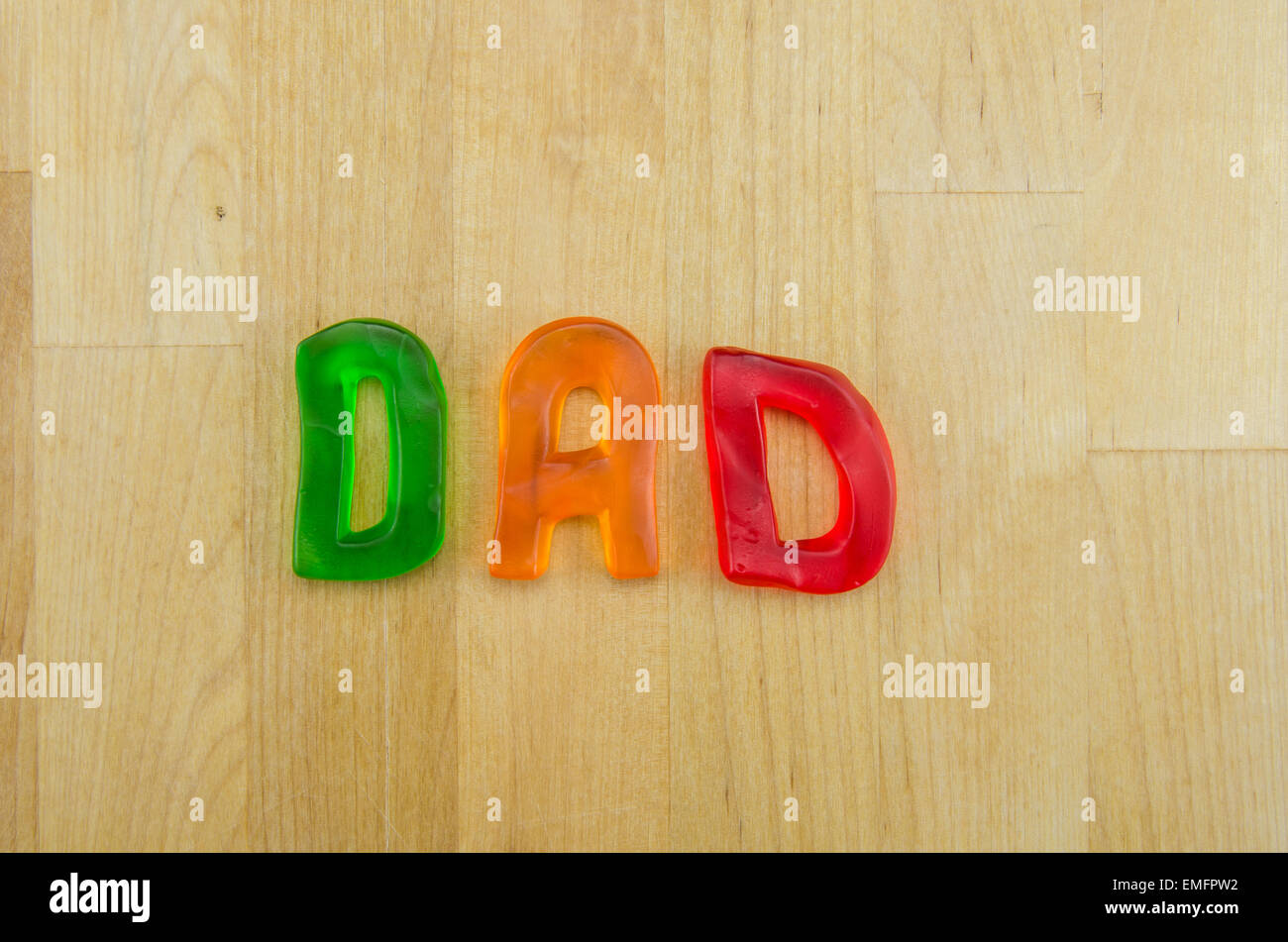 Multi colored letters spell the word dad Stock Photo - Alamy