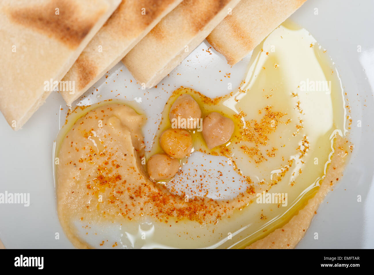traditional chickpeas Hummus with pita bread and paprika on top Stock ...