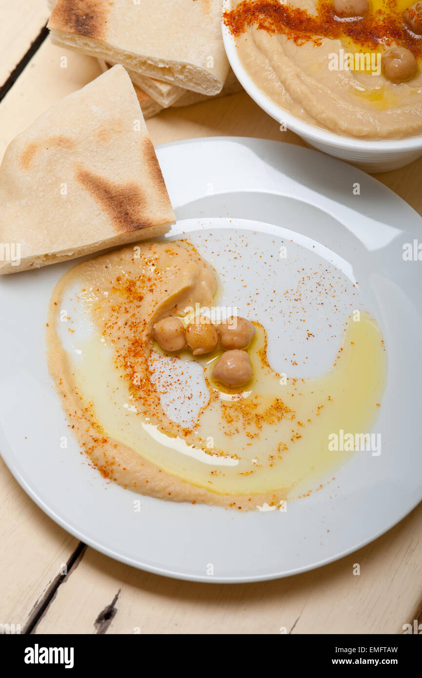 traditional chickpeas Hummus with pita bread and paprika on top Stock ...