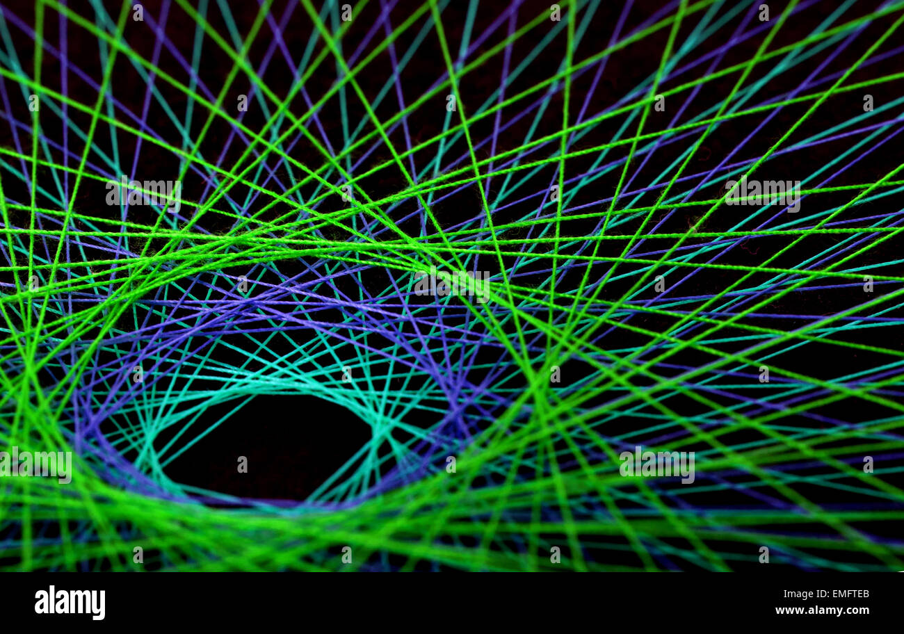 Display of colorful threads on a black panel Stock Photo - Alamy