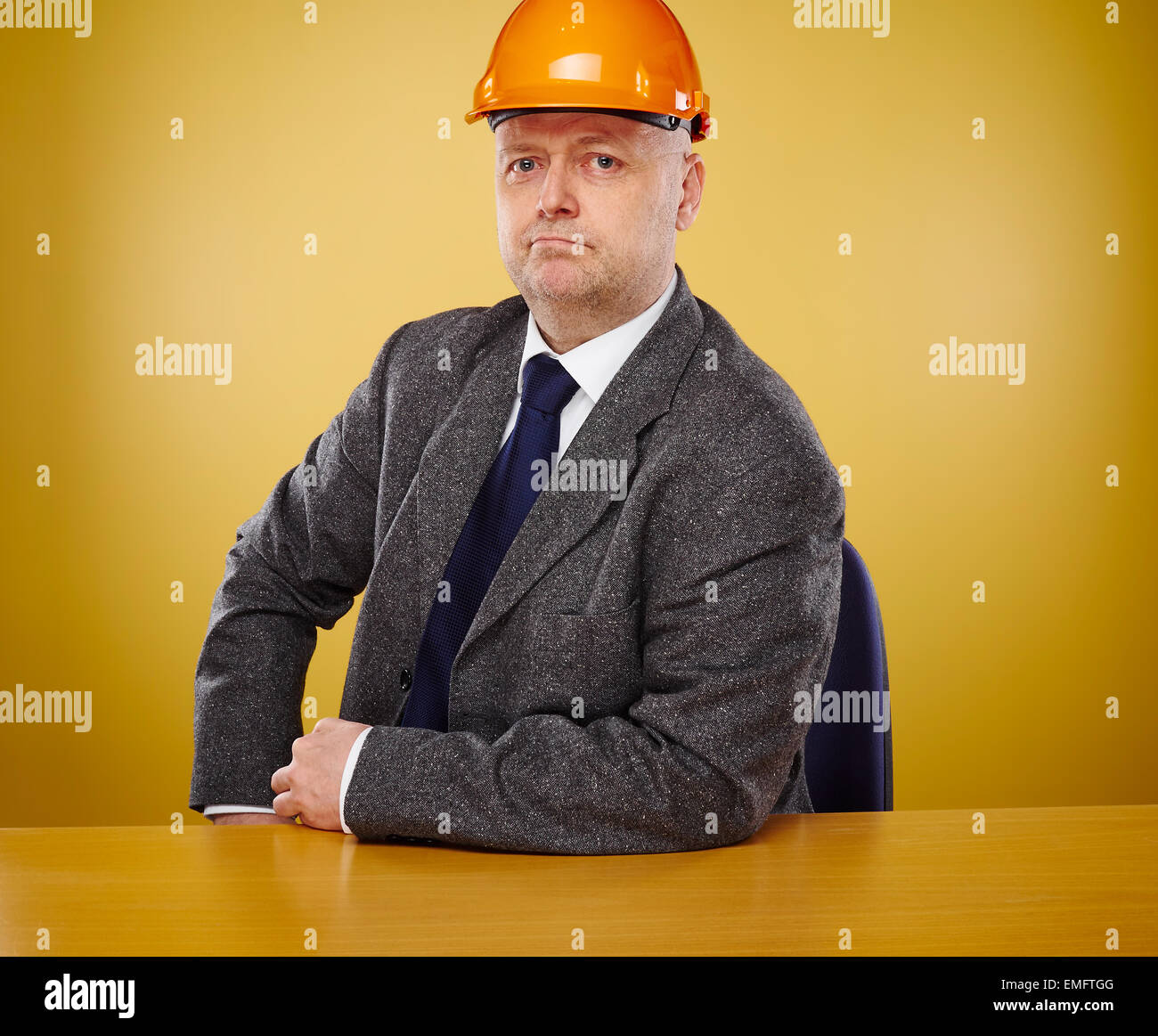 Working male engineer in office, he wearing a white shirt and tie and ...