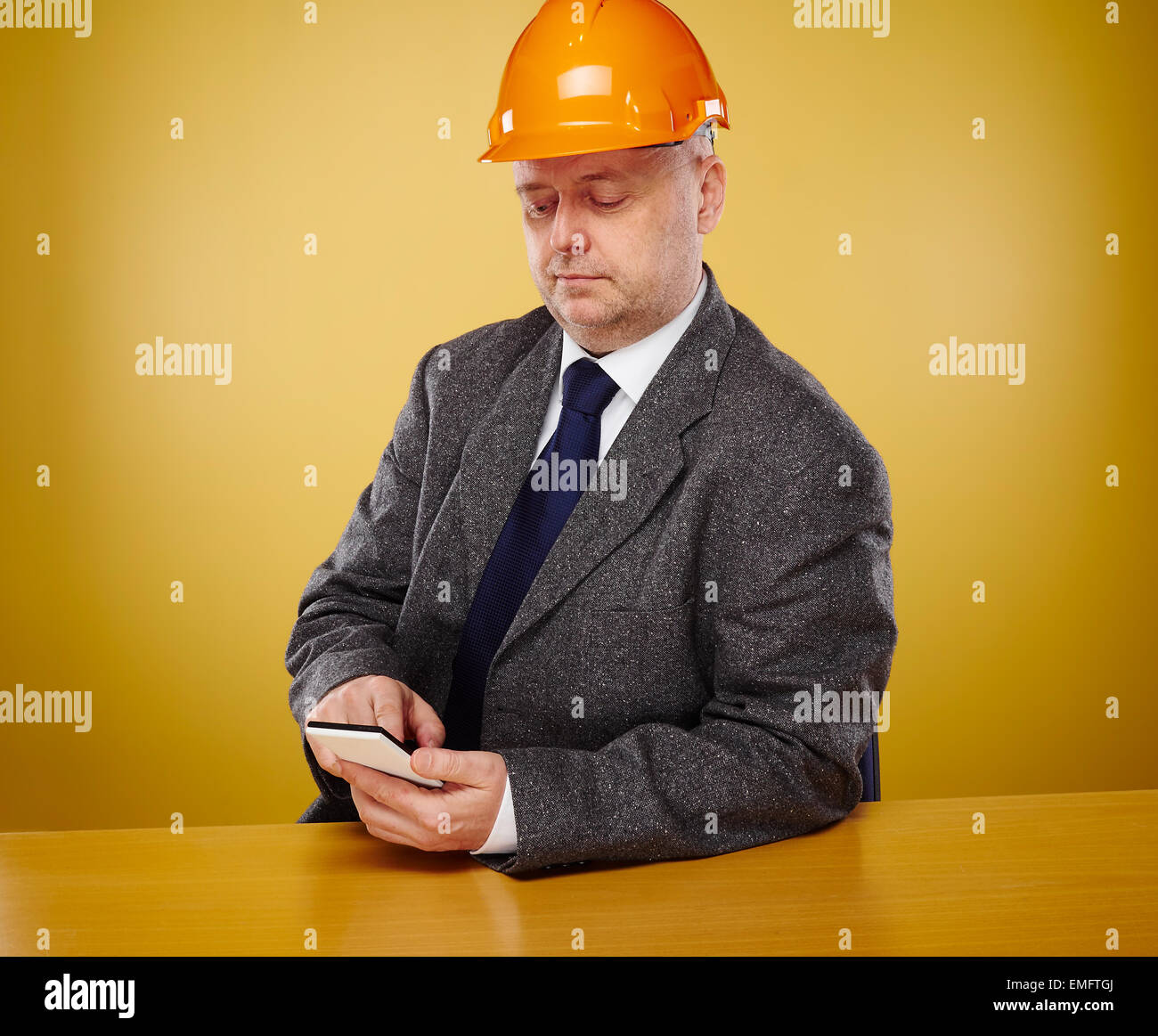 Working male engineer in office, he wearing a white shirt and tie and ...