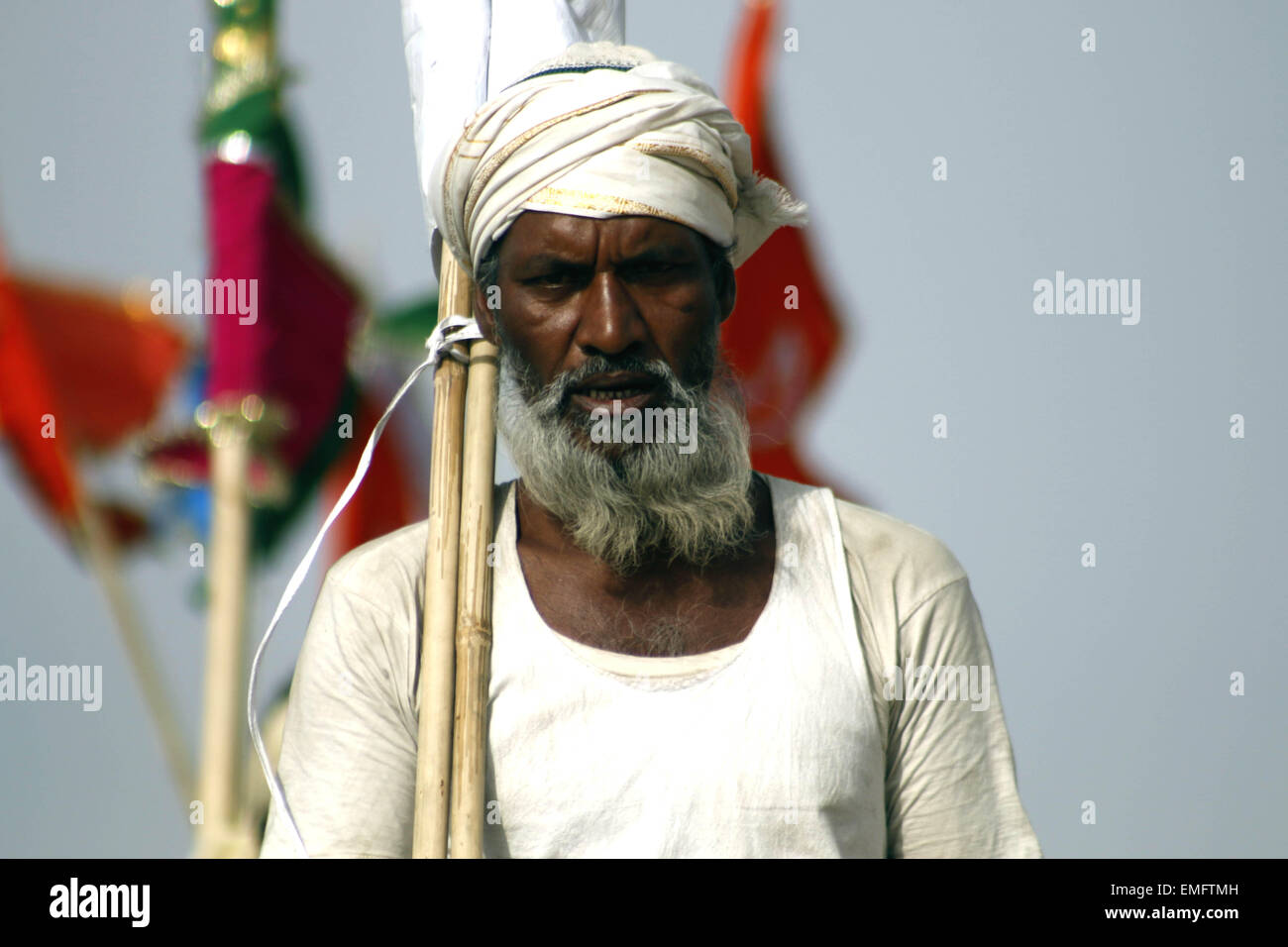 Ajmer, India. 18th Apr, 2015. Sufi Muslim pilgrims carry flags as they ...