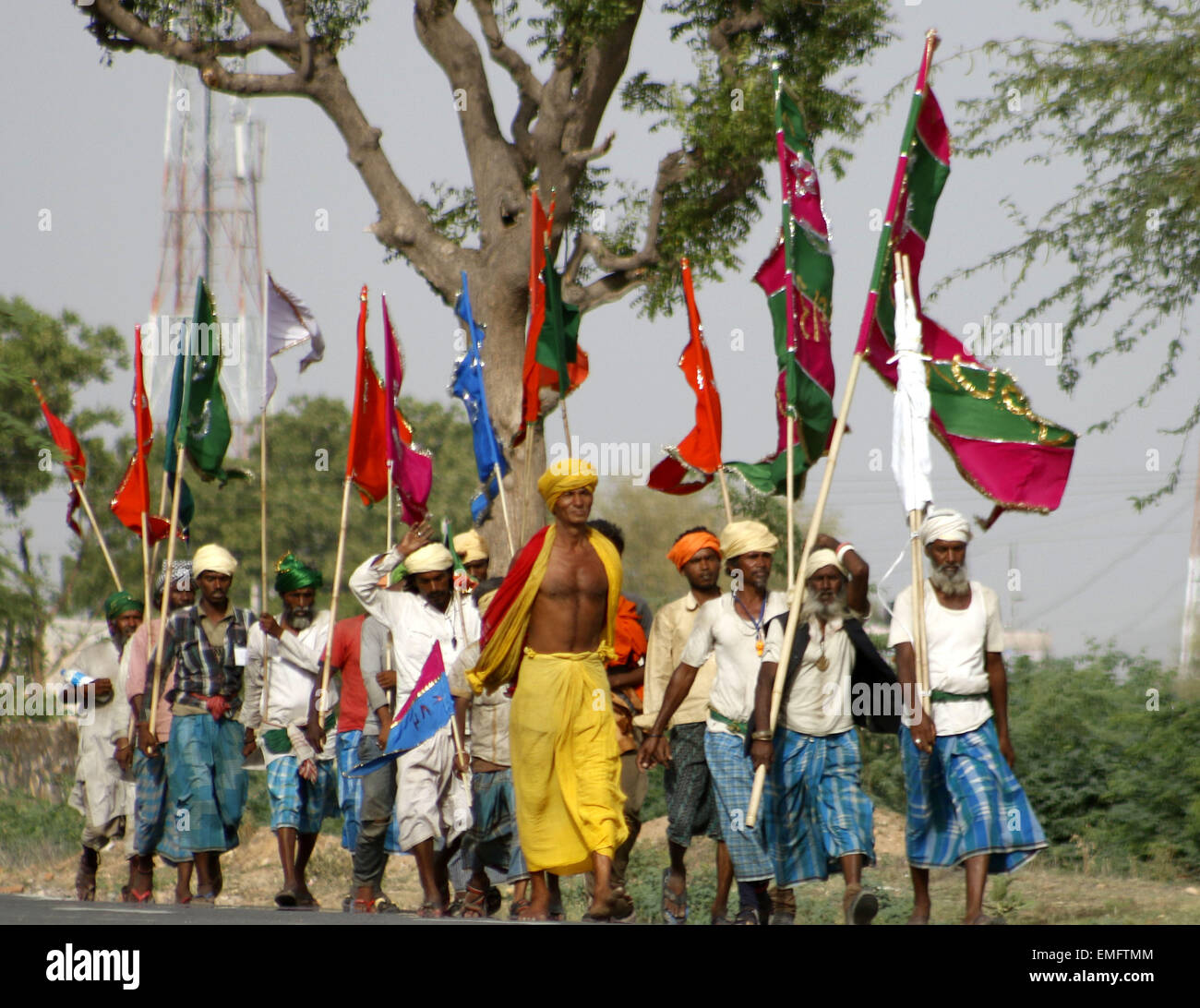 Ajmer, India. 18th Apr, 2015. Sufi Muslim pilgrims carry flags as they ...