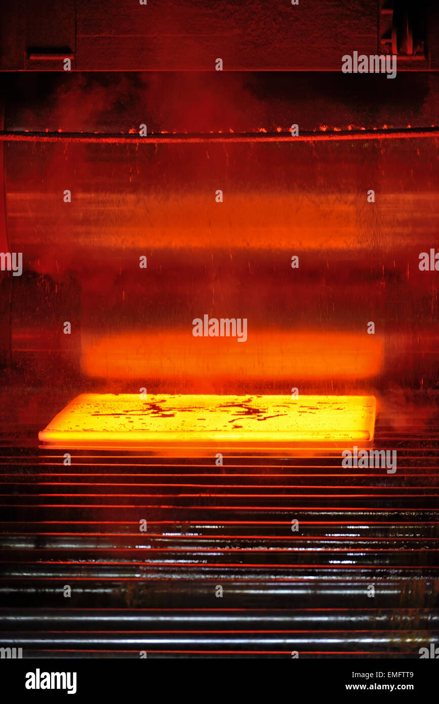 hot steel plate on conveyor Stock Photo - Alamy