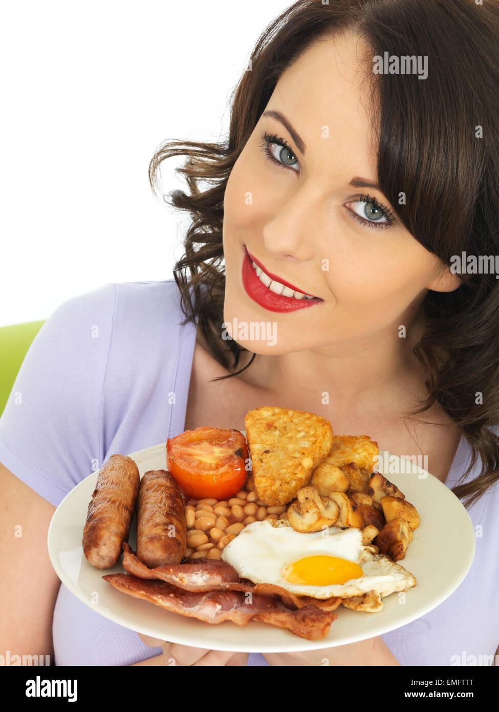 Young Confident Woman With Dark Hair Eating A Traditional Fried Full ...