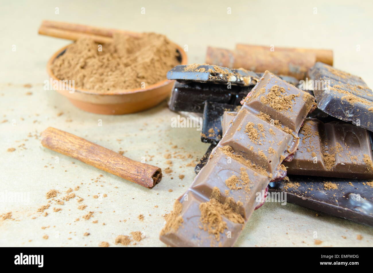 Bunch of chocolate sticks, cinnamon and hazelnuts on a table Stock ...