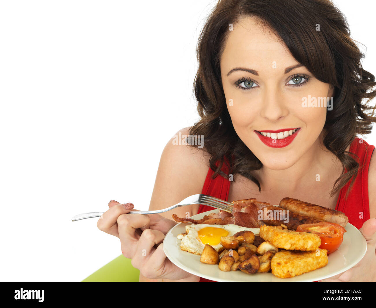 Young Confident Woman With Dark Hair Eating A Traditional Fried Full ...
