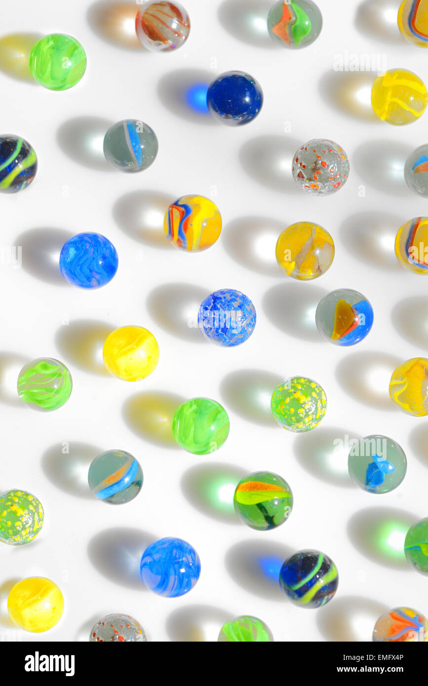 colorful glass marbles on white background Stock Photo - Alamy
