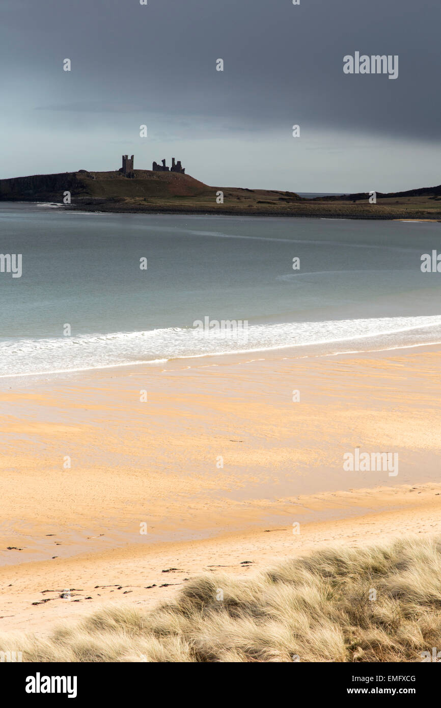 Dunstanburgh Castle across Embleton Bay on the north east coast of ...