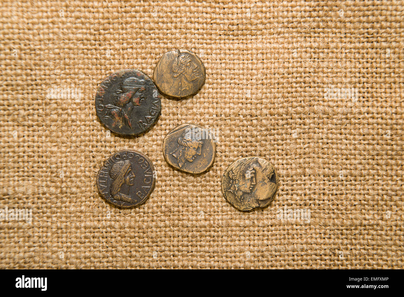 Ancient coins with portraits of emperors are on old sacking Stock Photo ...