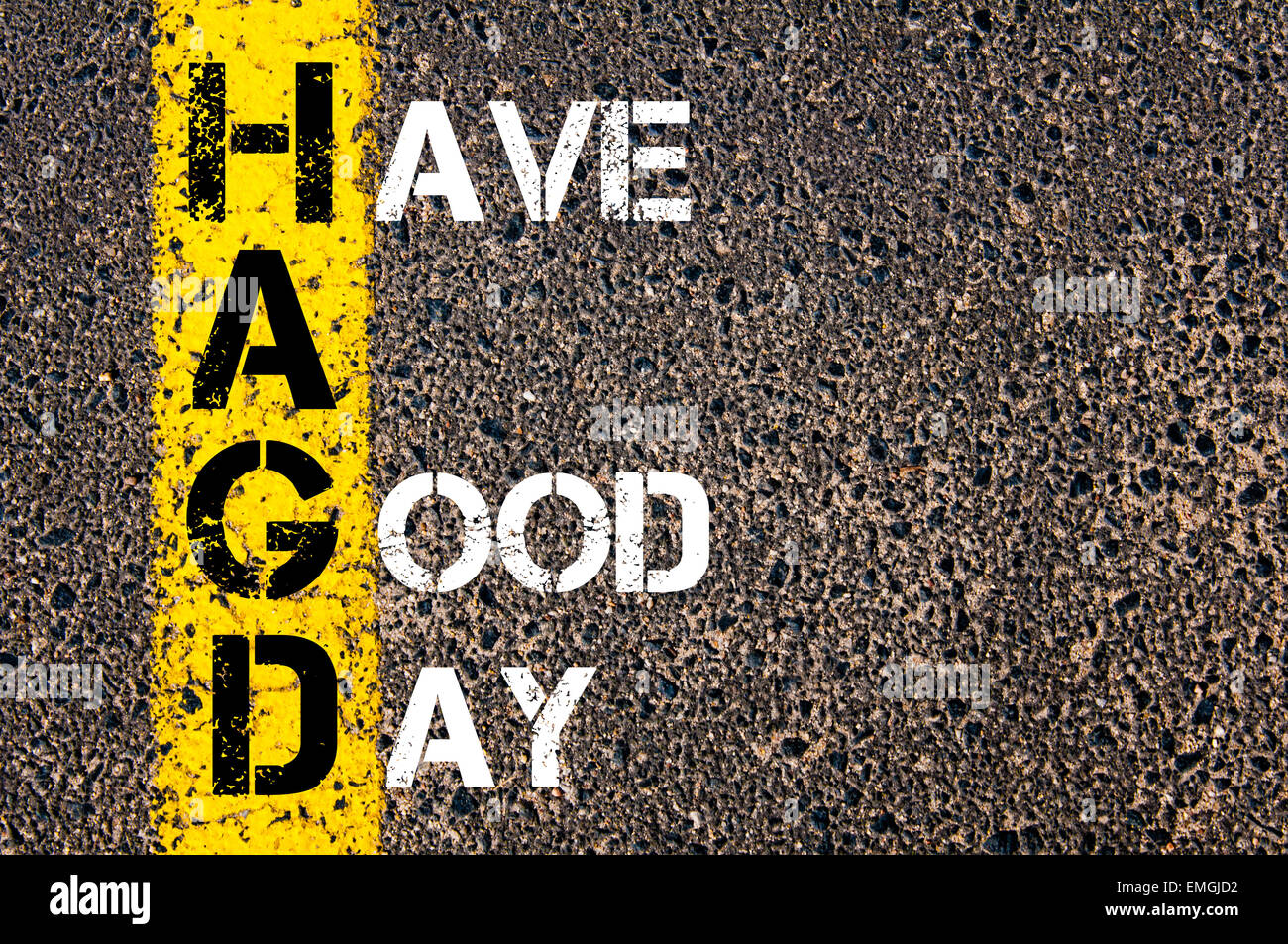 Acronym HAGD as Have a Good Day. Yellow paint line on the road against ...