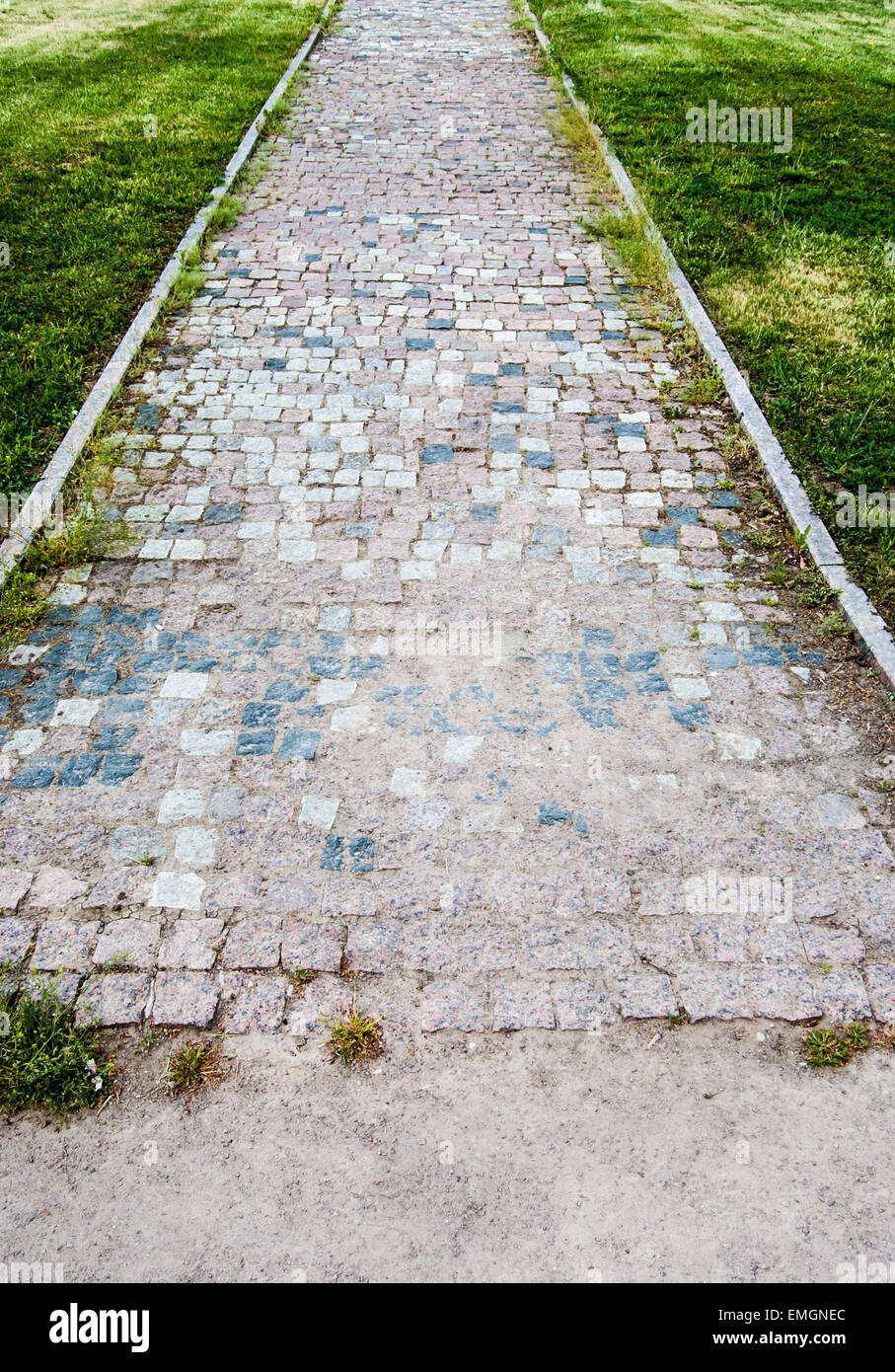 tiled pathway in green park, outdoors Stock Photo - Alamy