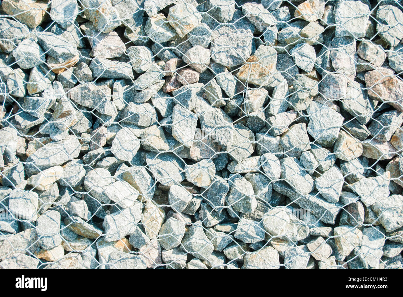 pebble stones in aluminiummesh Stock Photo - Alamy