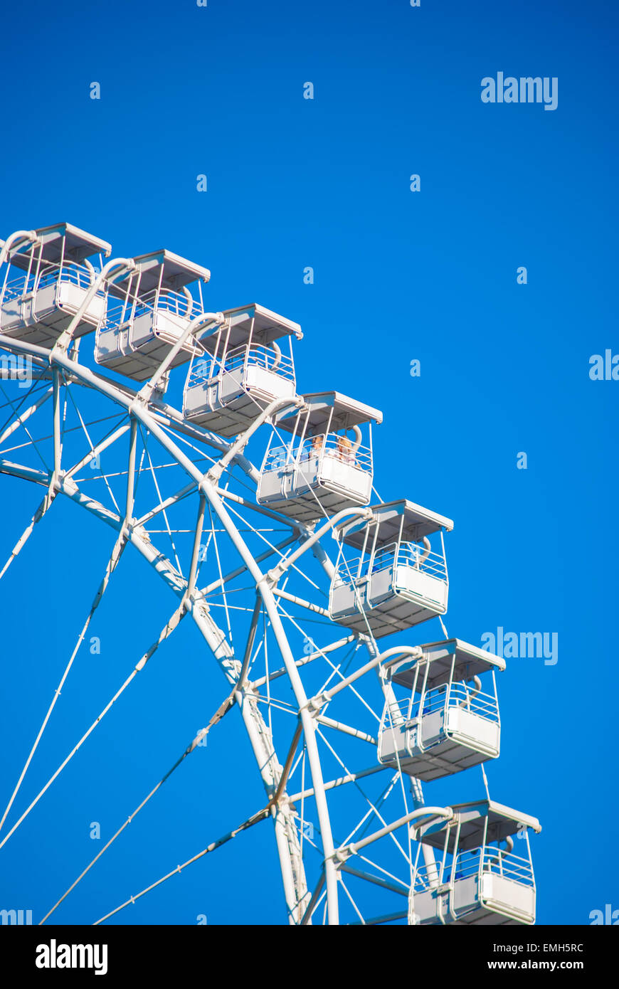 White ferris wheel against blue sky Stock Photo - Alamy