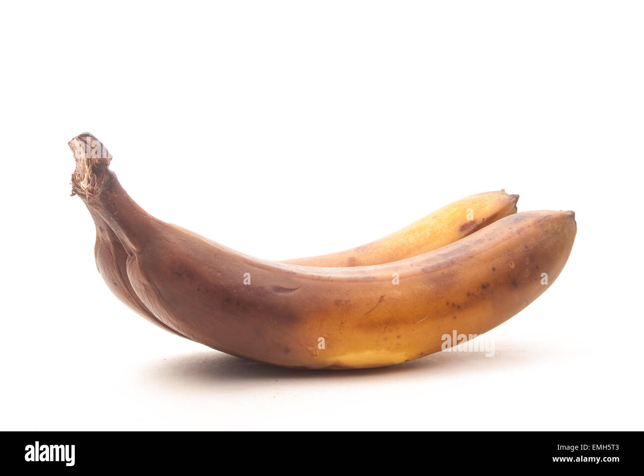 old banana on white Stock Photo - Alamy