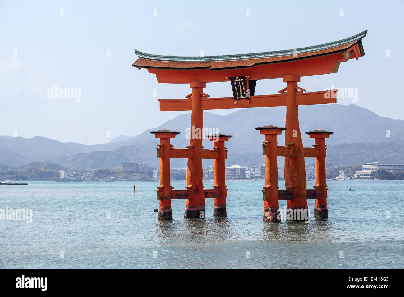 Red torii in shallow water near the island of Miyajima (Itsukushima ...