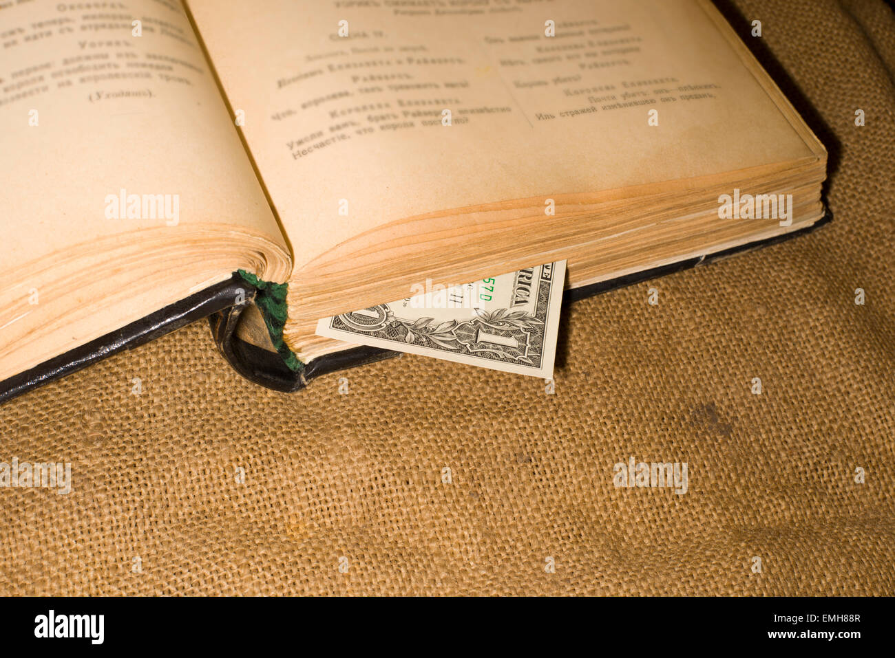 Open book with a bookmark from $ 1 on sacking Stock Photo - Alamy